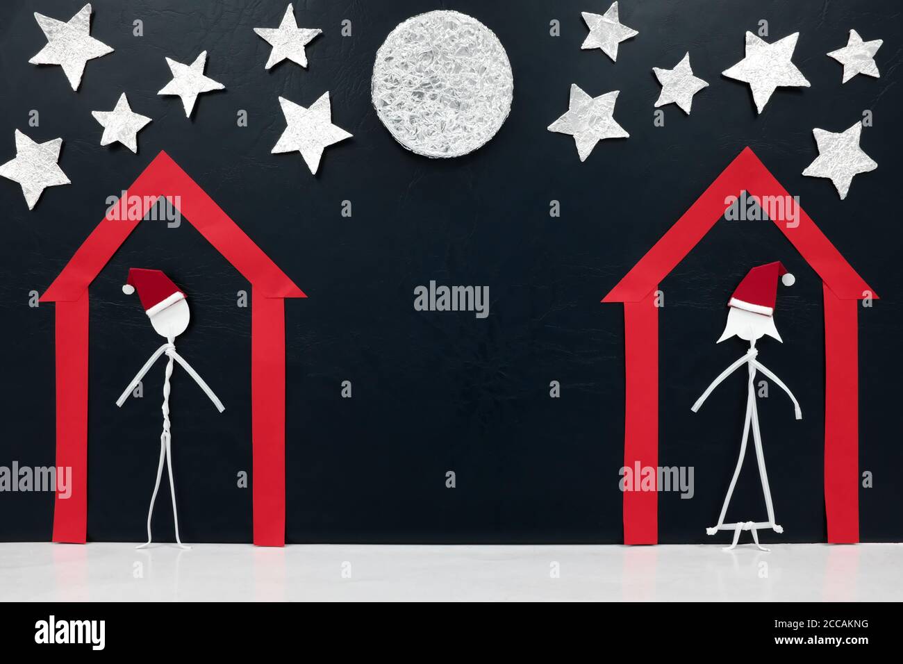 Stick man couple figure wearing santa hat inside a red house. Isolation ...