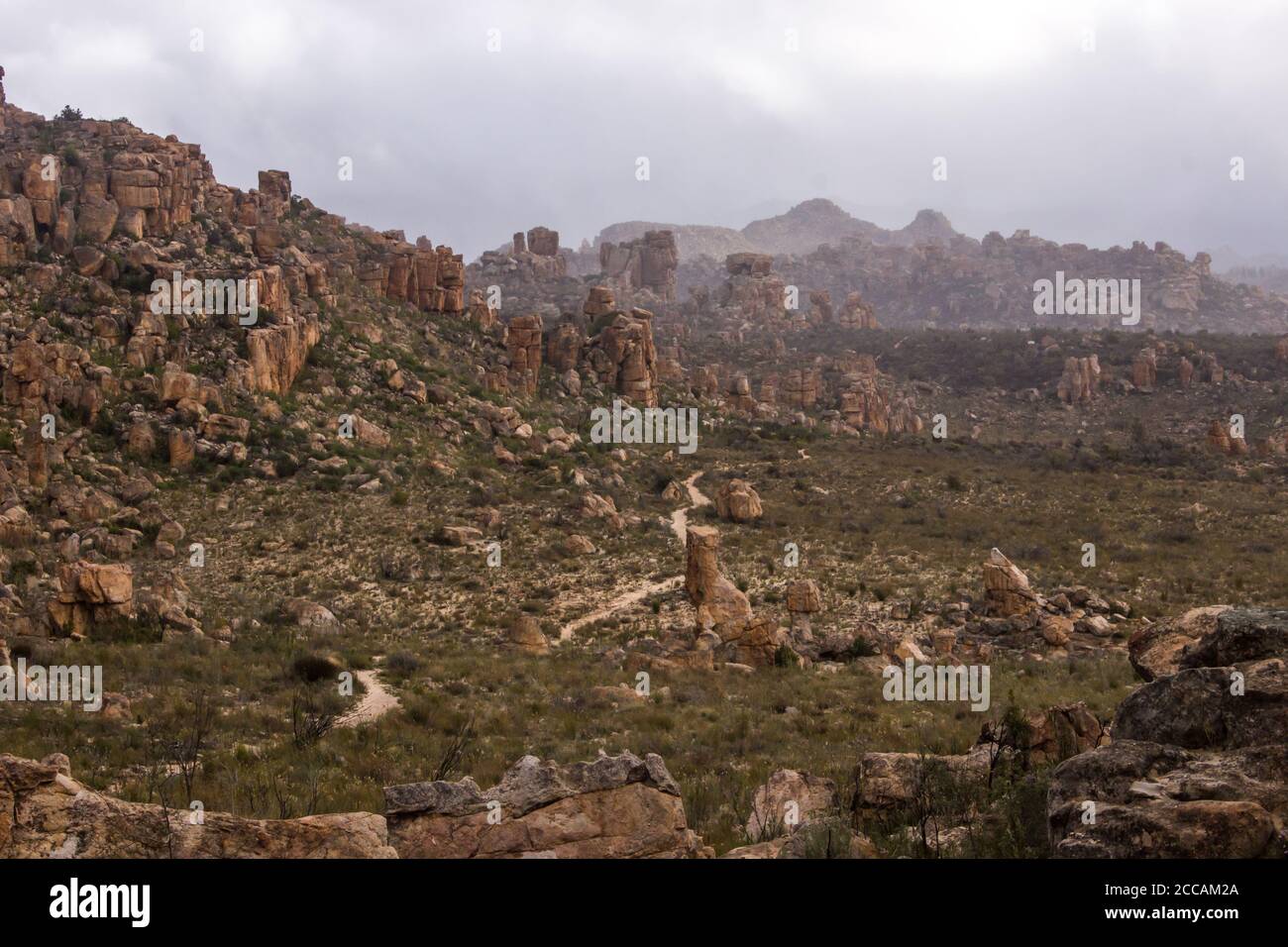 A hiking trail winding through the weathered Sandstone pillars of the ...