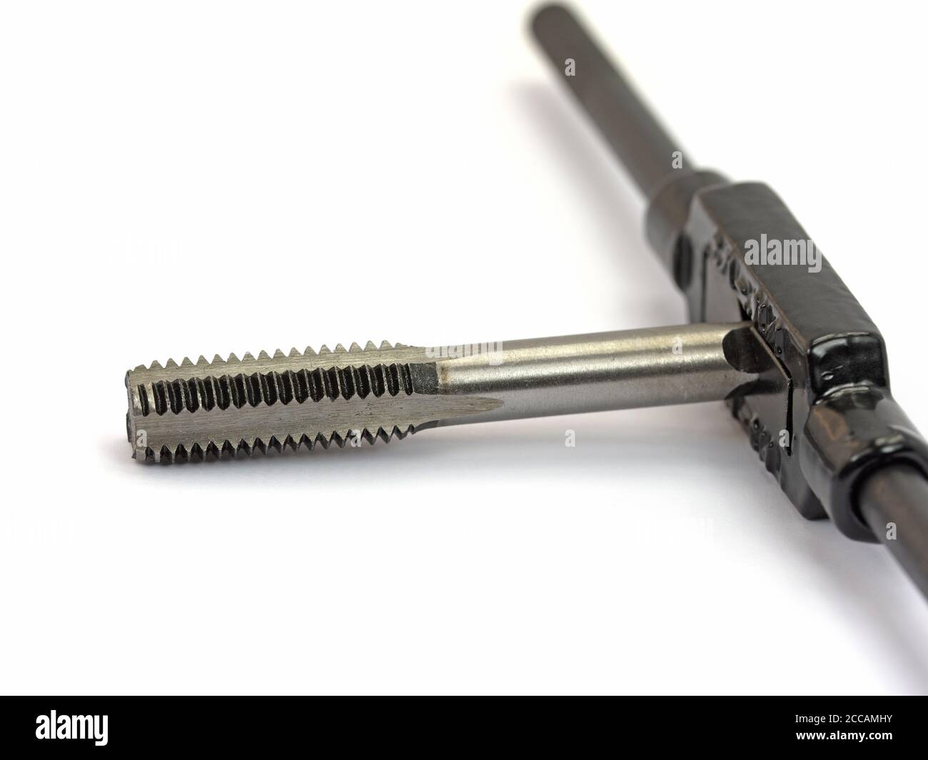 Thread drill against white background Stock Photo - Alamy