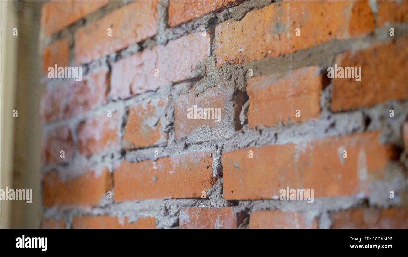 Red Old Weathered Brick Wall. Brick wall with putty. Wall repair Stock ...