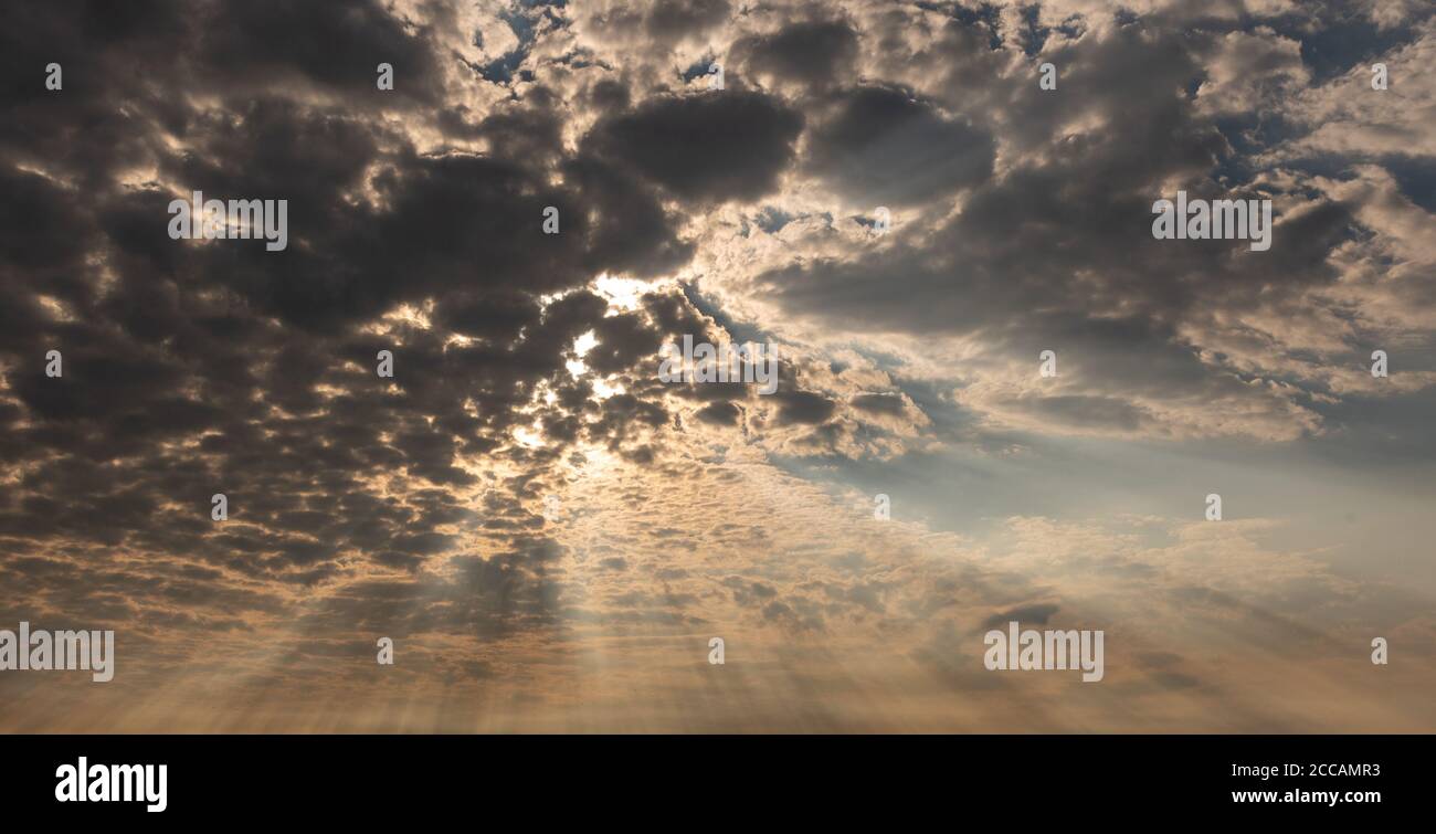 Late afternoon landscape with the sun setting over the horizon of the ...