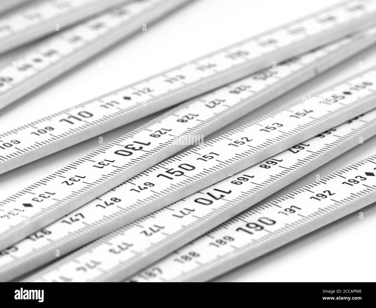 Folding rule against white background Stock Photo - Alamy