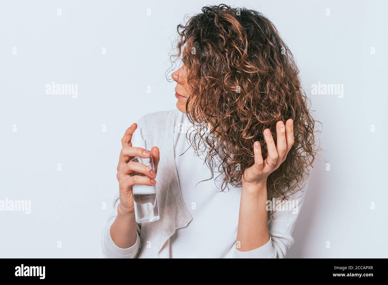 Female hairdresser using hair spray hi-res stock photography and images ...