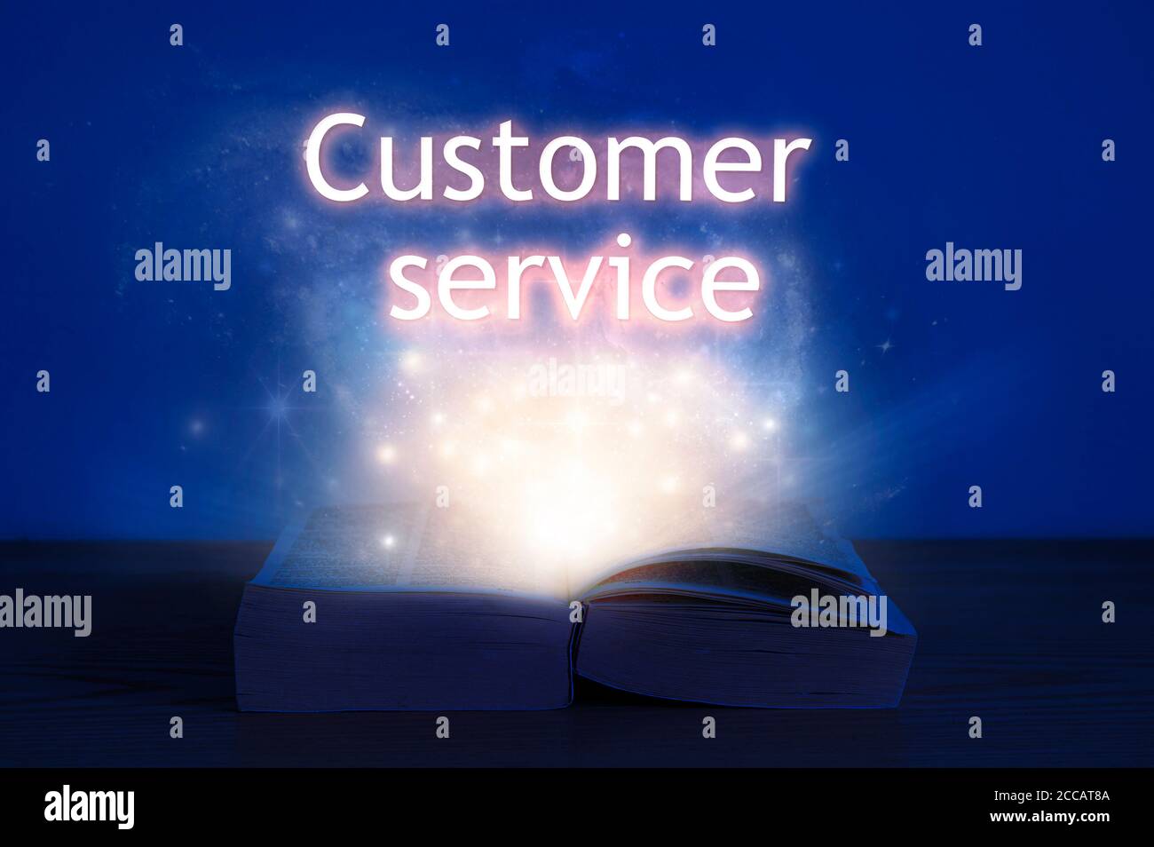 Open book with customer service inscription. Light coming from open ...