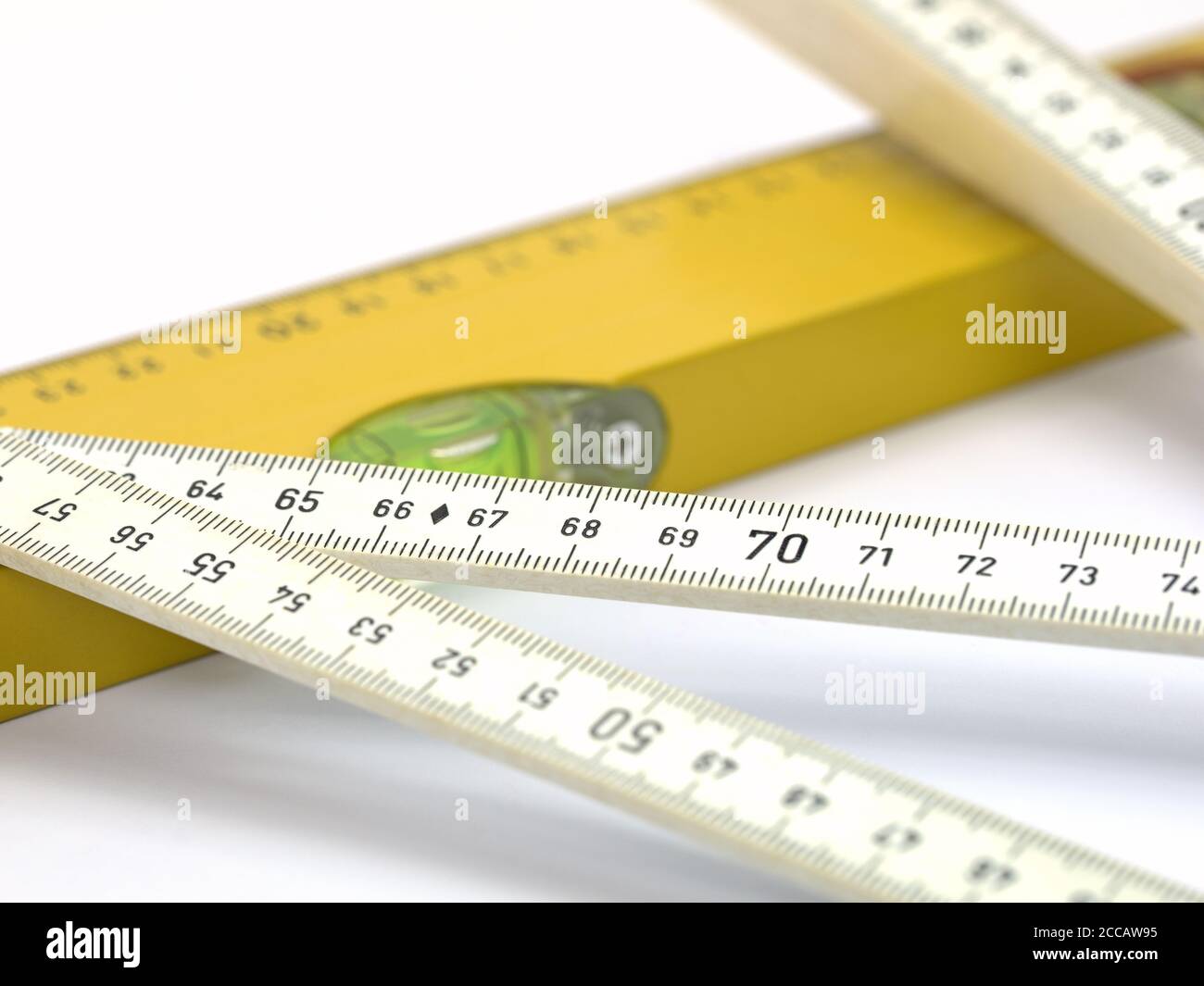 Folding rule and spirit level Stock Photo - Alamy
