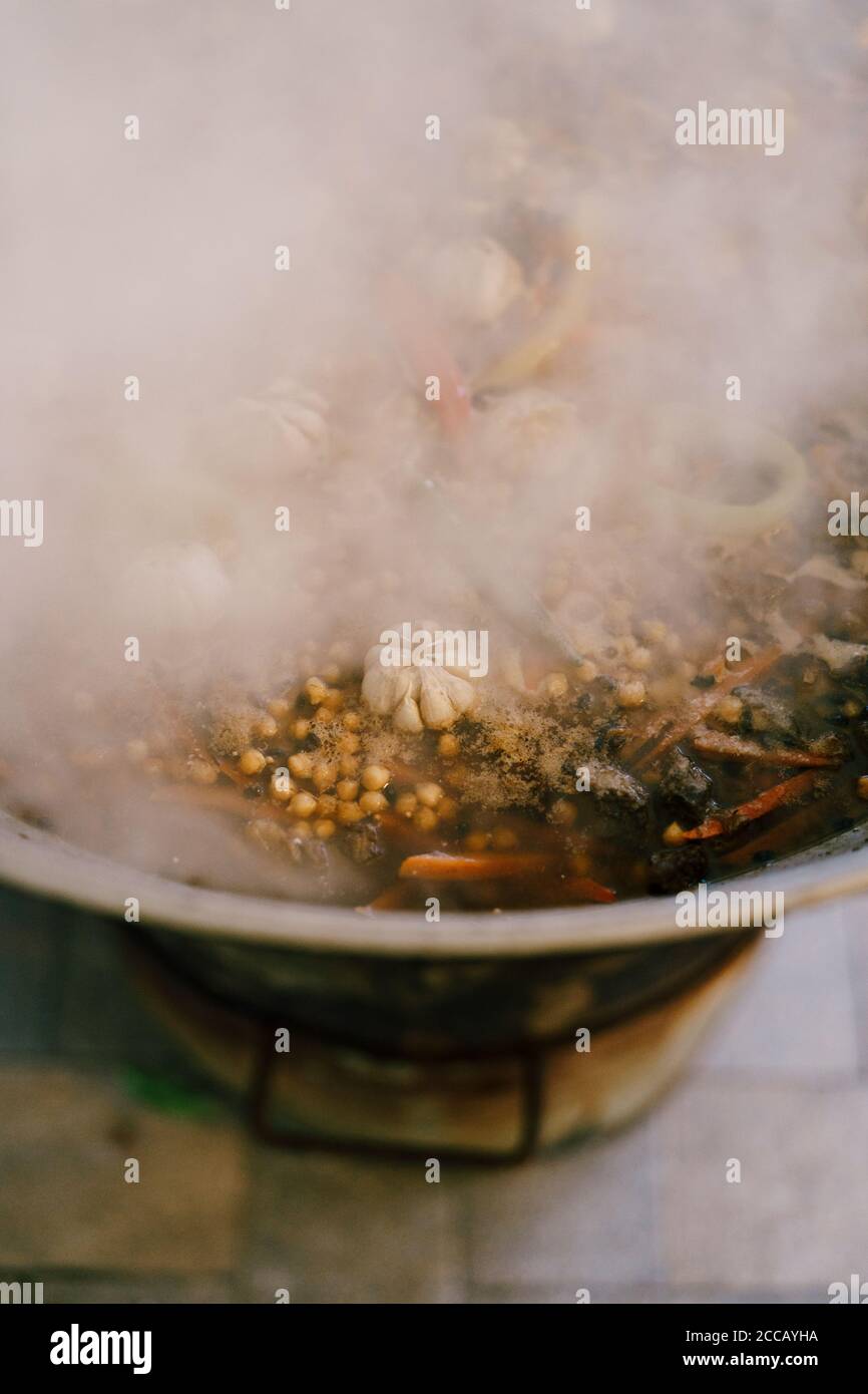 A close-up of the cauldron with a pilaf covered with steam Stock Photo ...