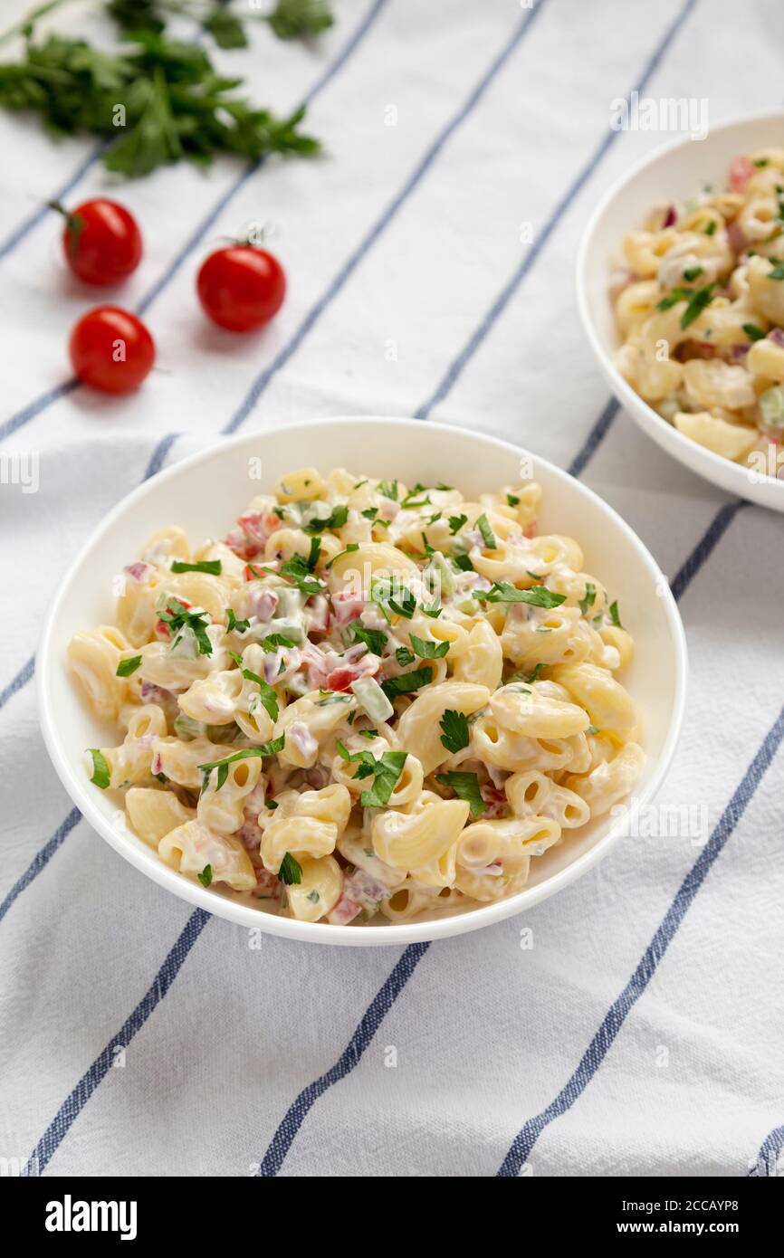 Homemade Macaroni Salad in white bowls, side view Stock Photo - Alamy