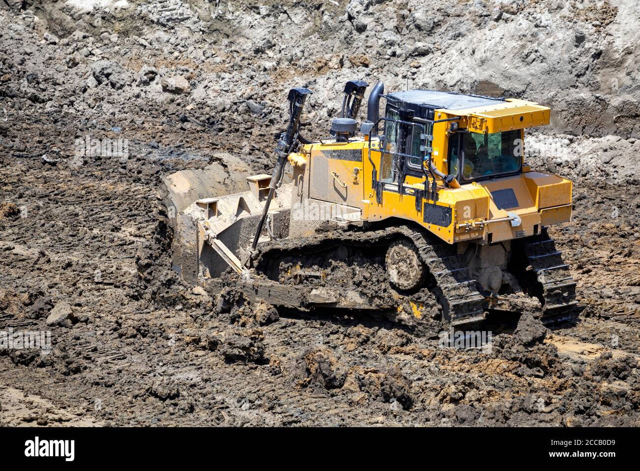 Bulldozer work at a construction site. Heavy metal blades of bulldozer ...