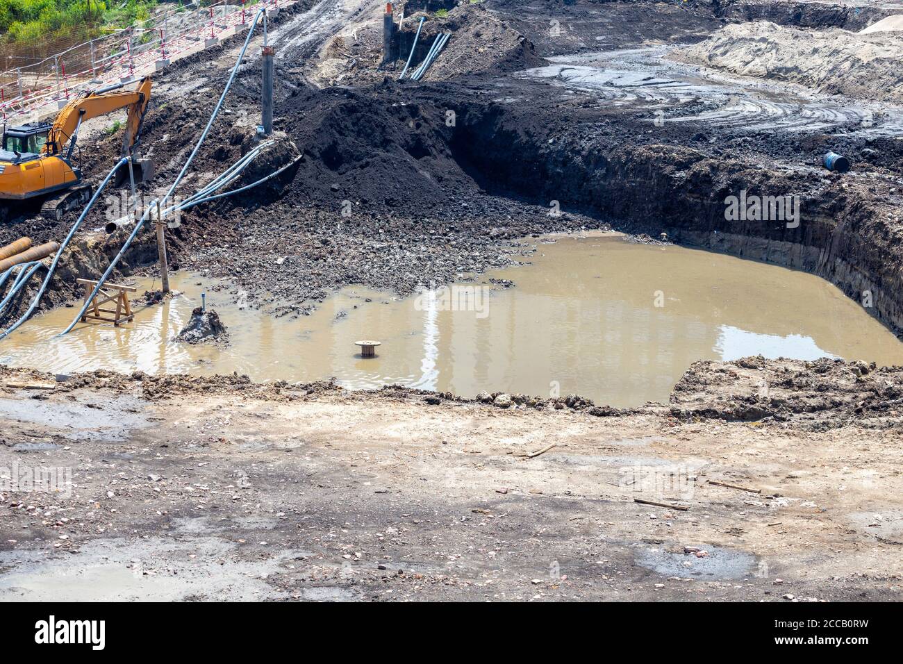 Excavation pit with groundwater, dewatering in construction Stock Photo ...