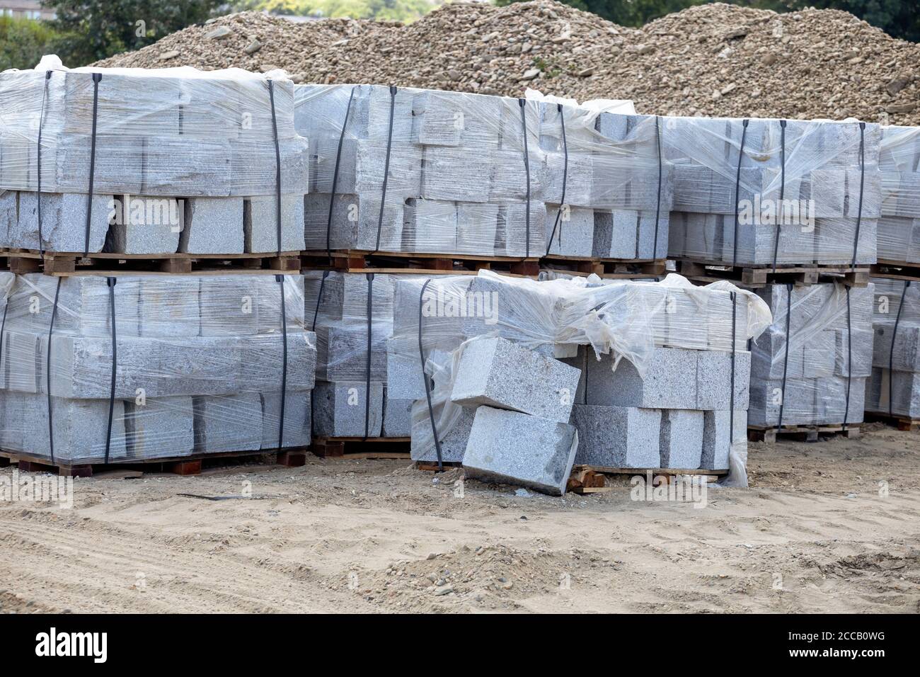 Granite building blocks on a wooden pallet, ready for installation on ...