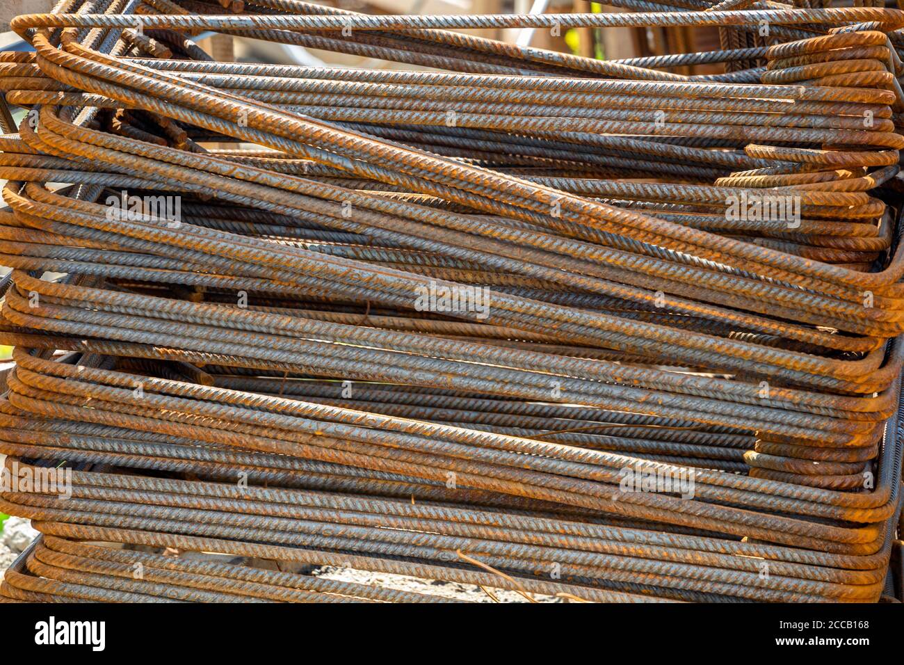 Ligatures for reinforcing footing beams background. Pile of reinforcing ...
