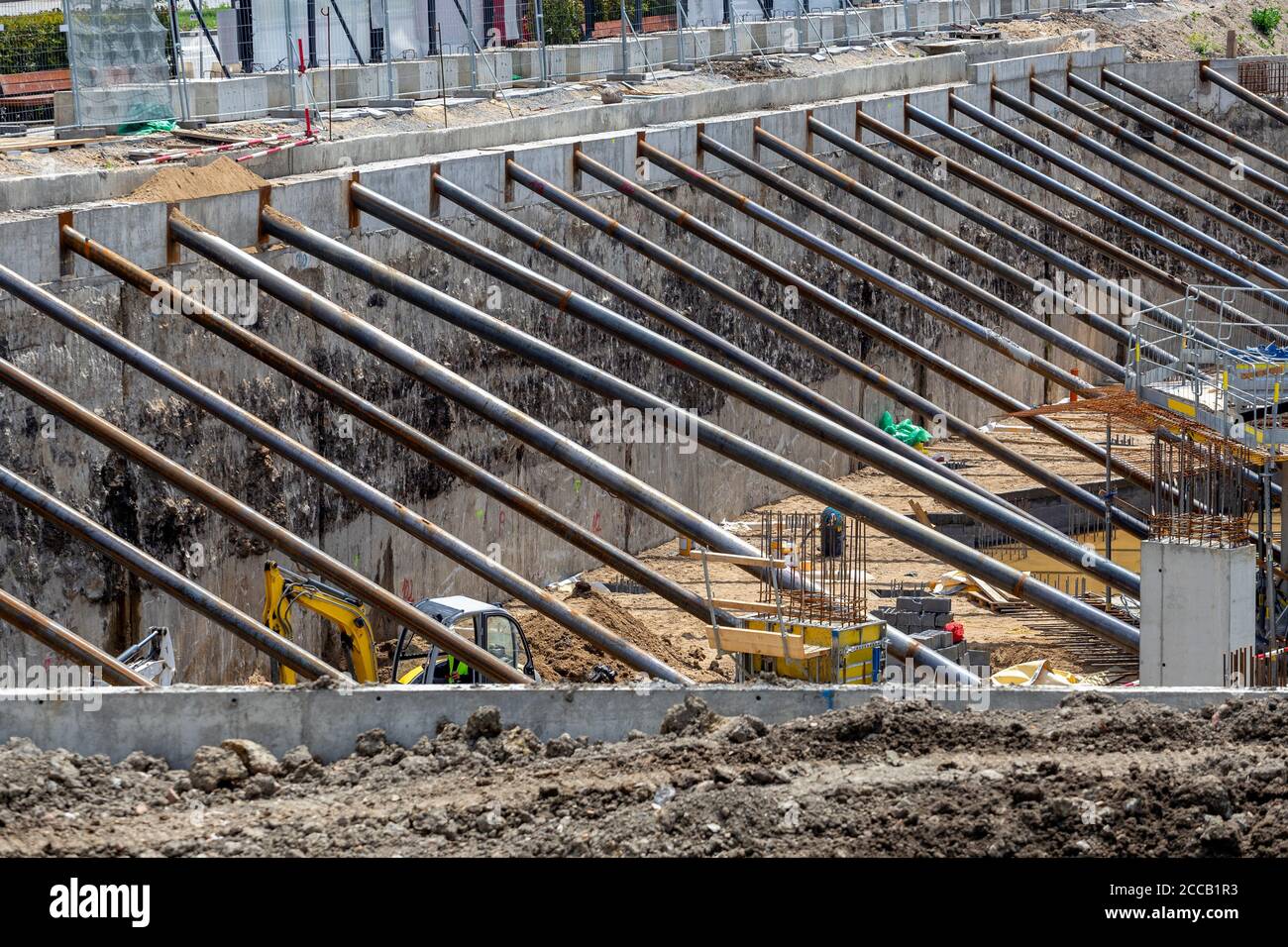 Steel beams supporting concrete wall in space for a new building at ...
