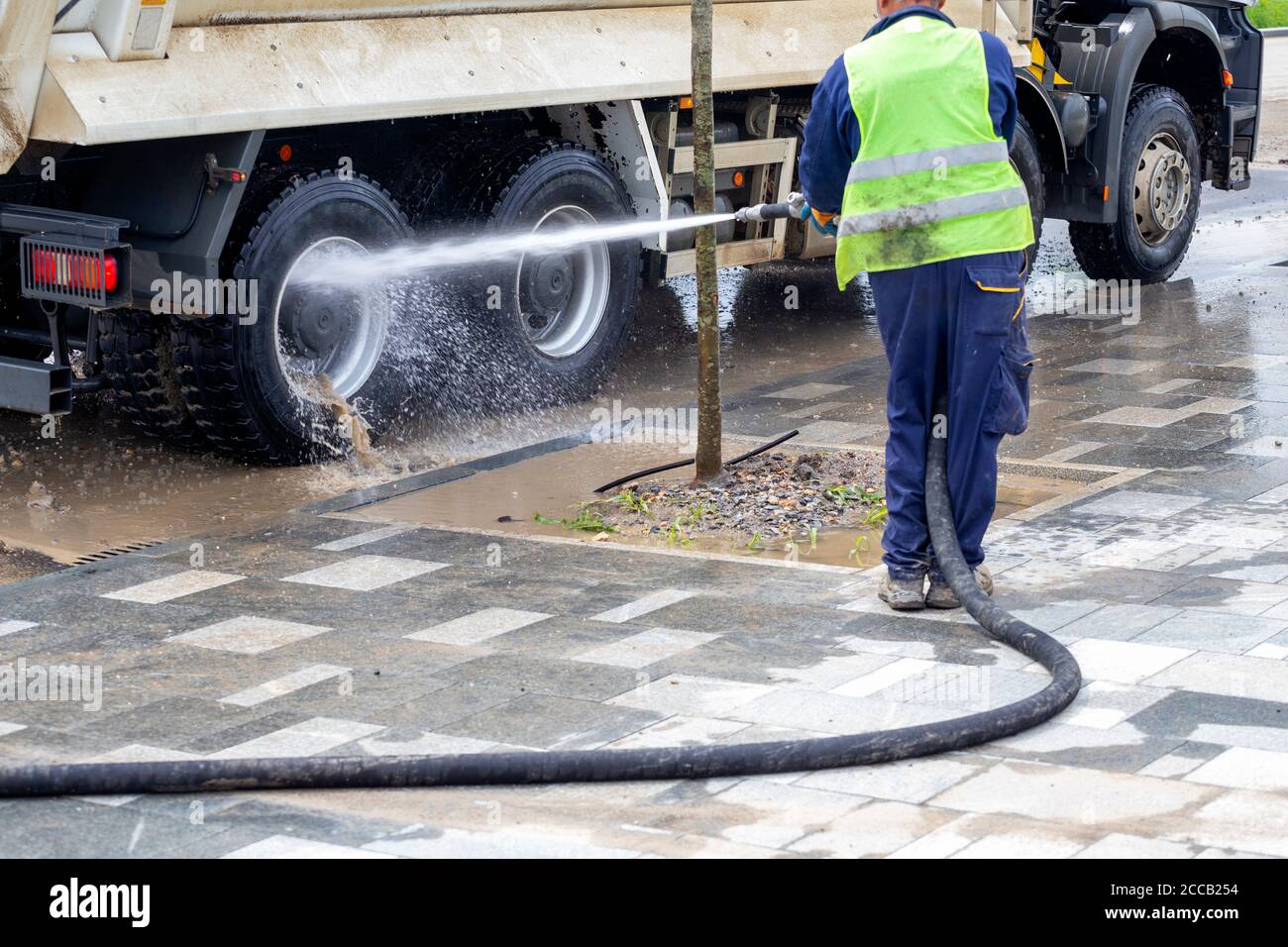 Wheel Washer at the construction site. Washing truck wheels off dirt on ...