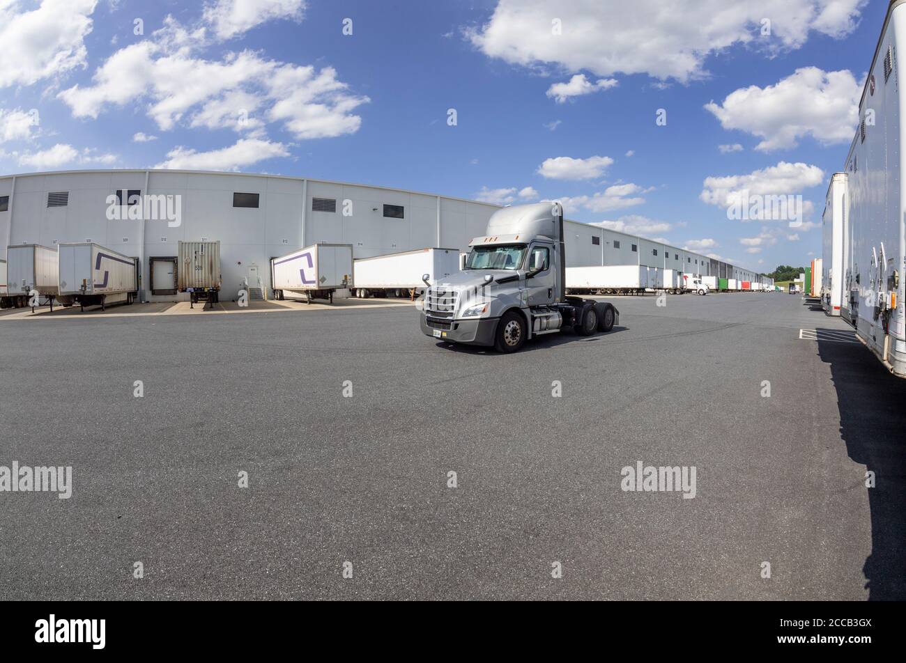 Warehouse with trucks Stock Photo - Alamy