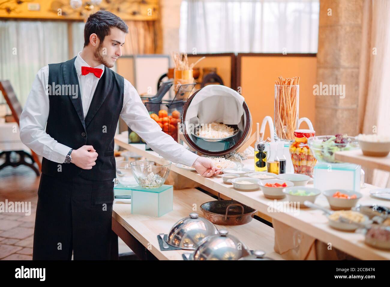 Hotel waiter breakfast hi-res stock photography and images - Alamy