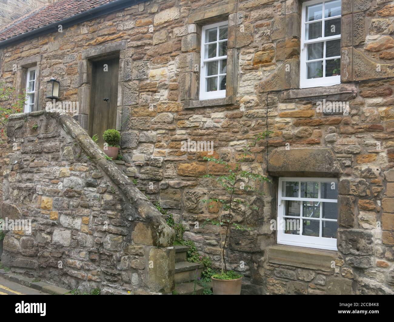 A typical quaint cottage in St Andrews, Fife, with the external stone ...