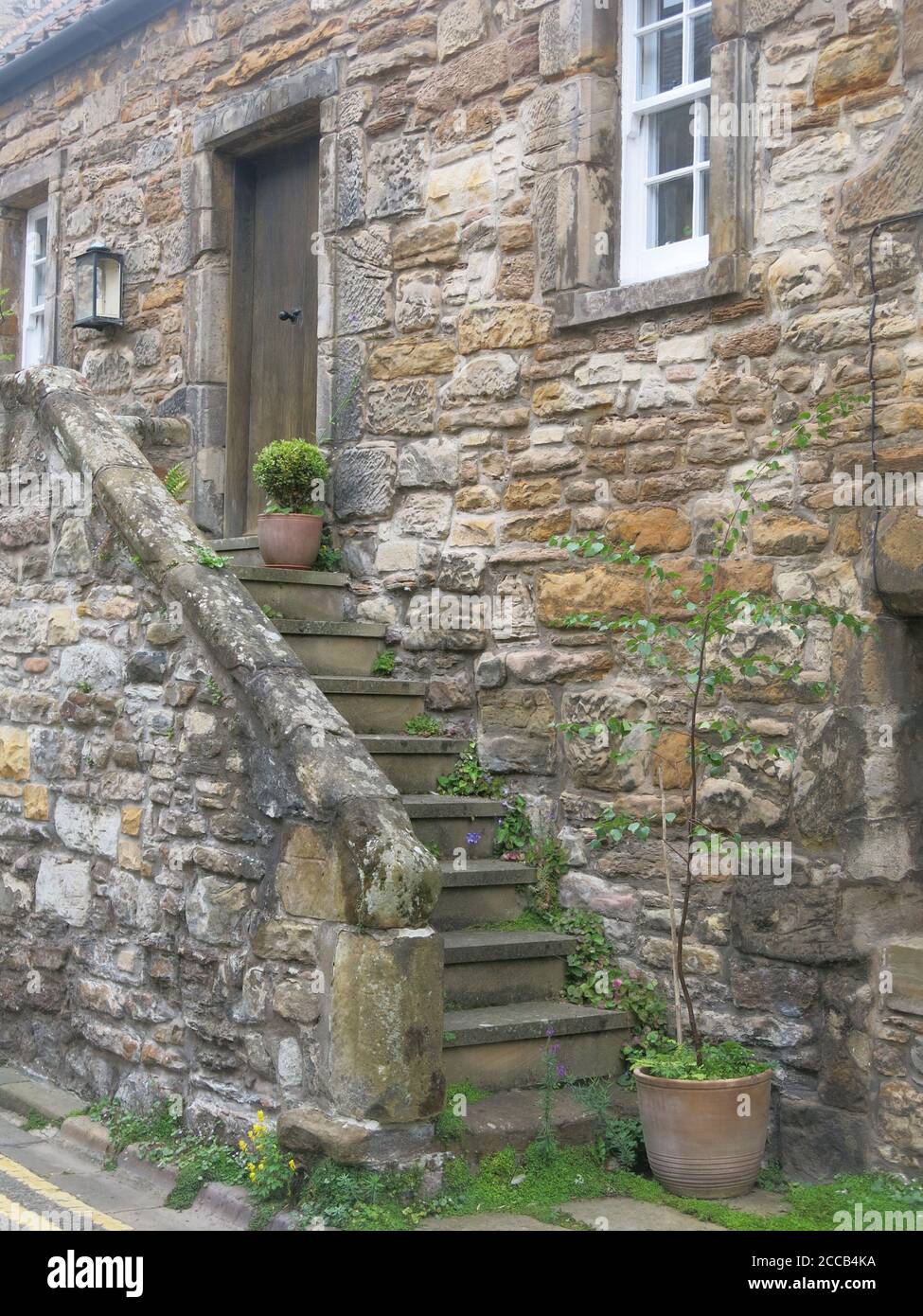 A typical quaint cottage in St Andrews, Fife, with the external stone ...