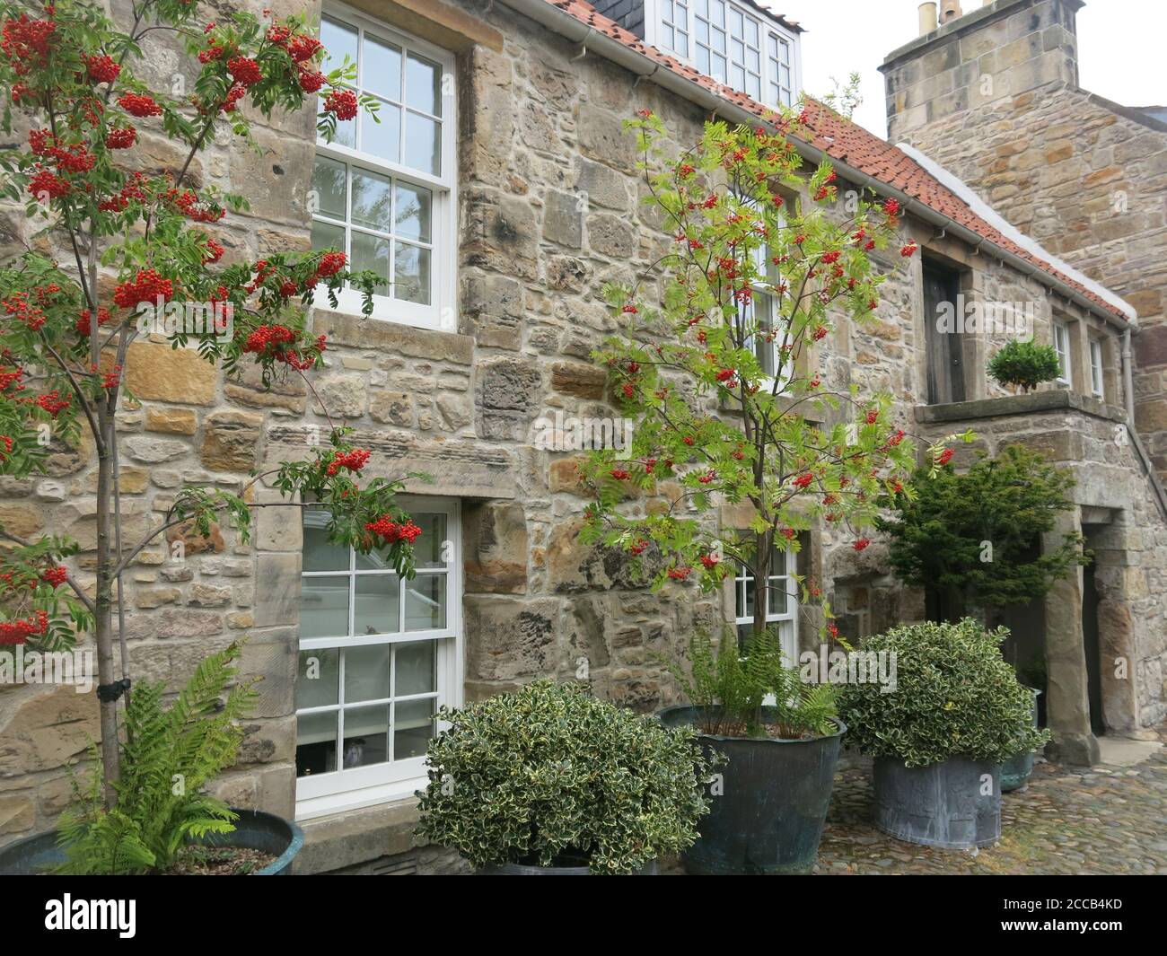 A typical quaint cottage in St Andrews, Fife, with the external stone ...