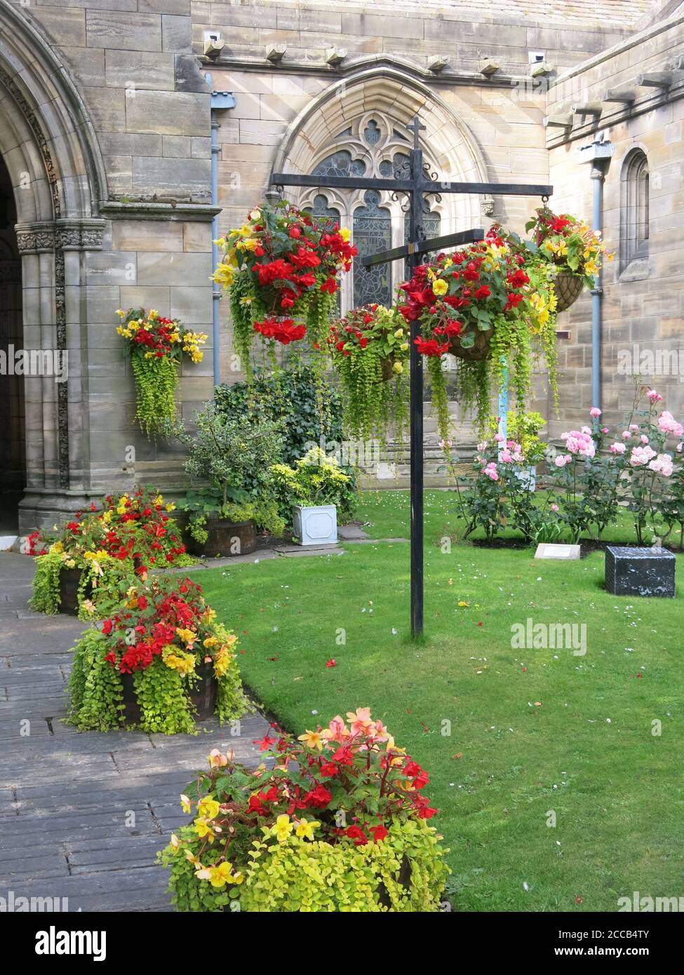 A summer planting scheme of red and yellow for the beautiful hanging ...