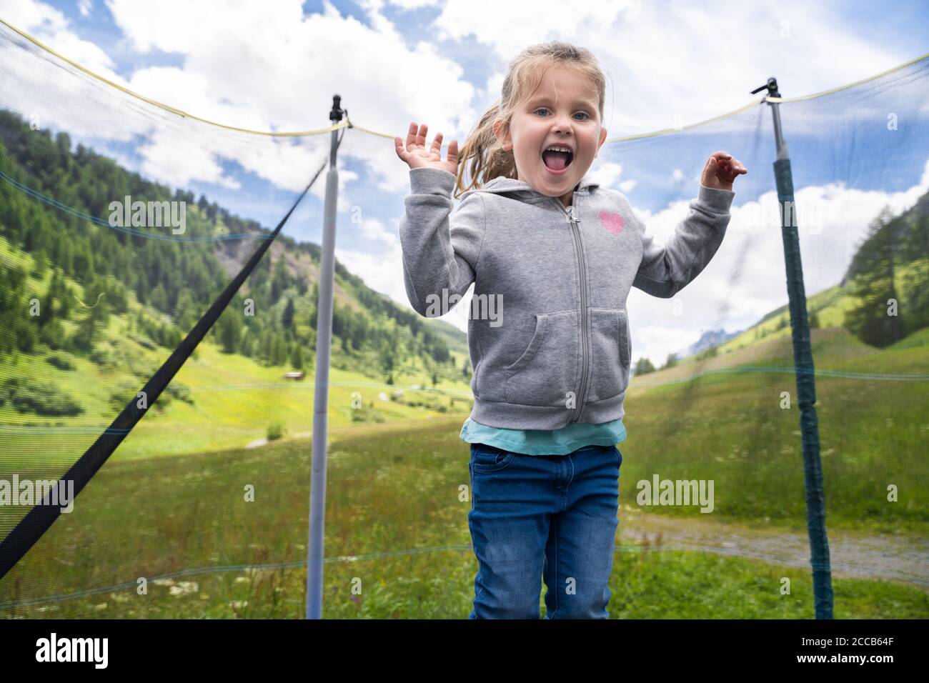 Child jumping with joy hi-res stock photography and images - Alamy