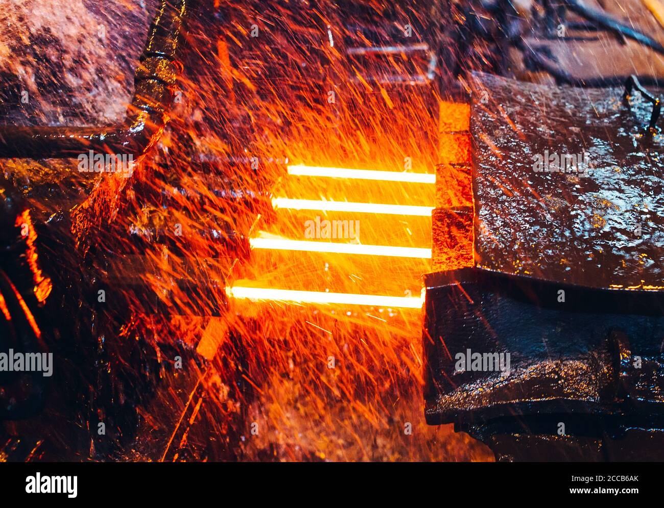 hot steel on conveyor in a steel mill Stock Photo - Alamy