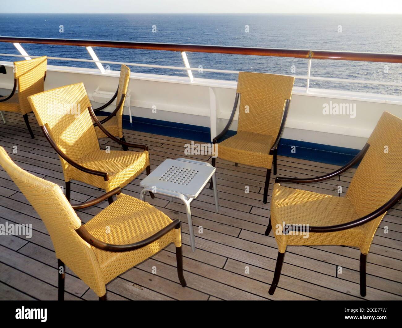 Chairs and table on a cruise ship deck Stock Photo - Alamy