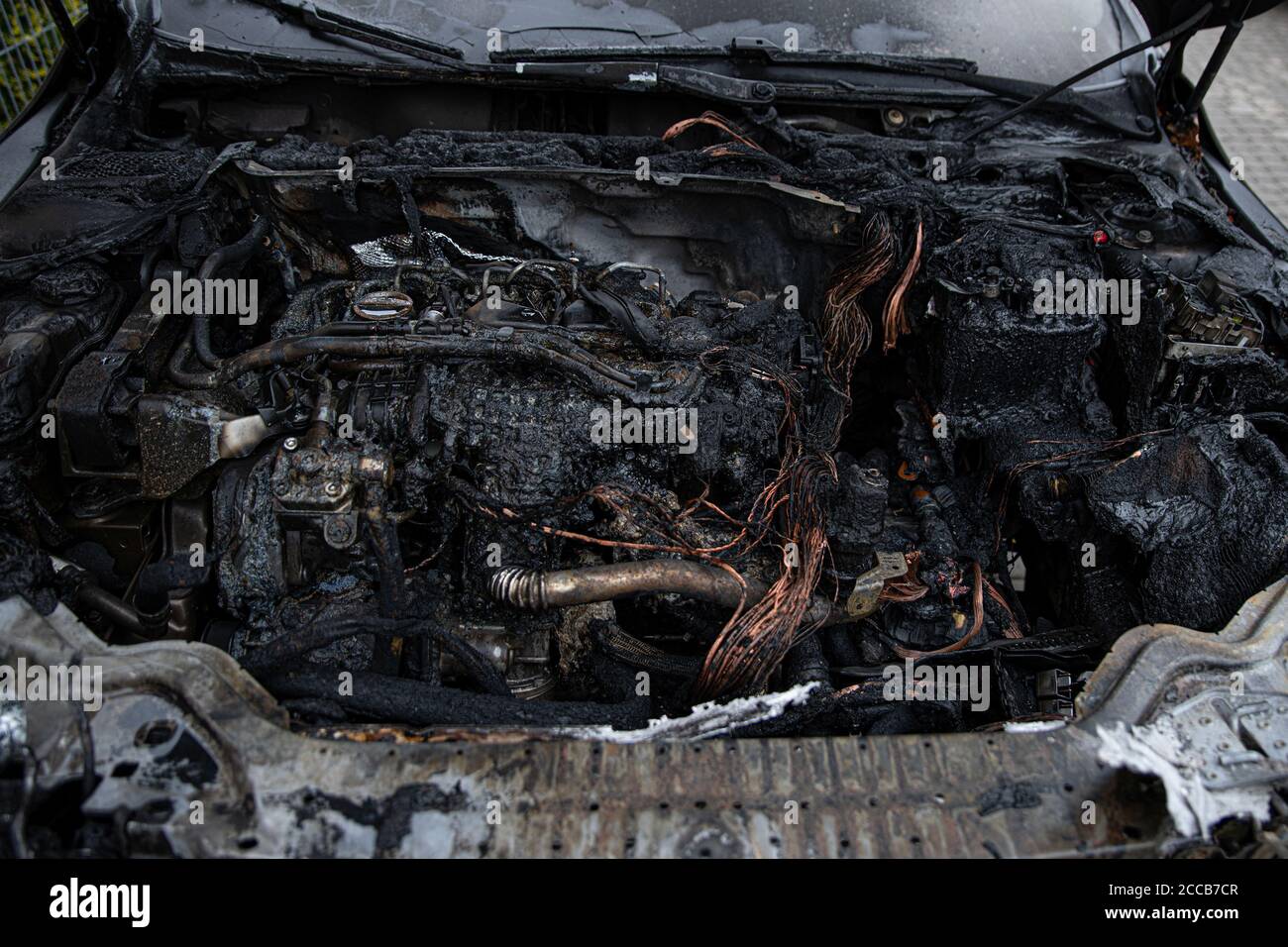 Burnt destroyed car engine after fire Stock Photo - Alamy