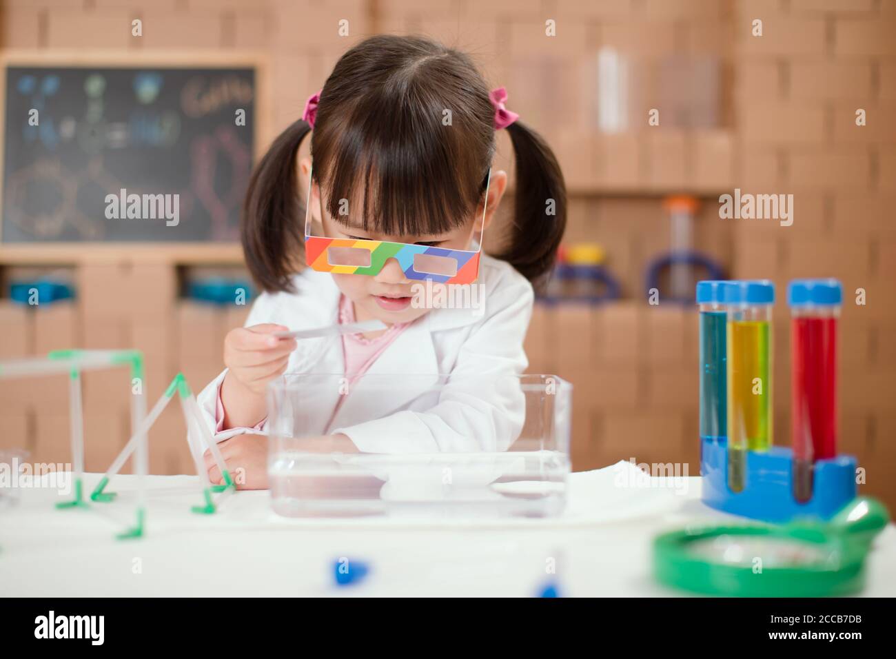 young girl play science experiments for homeschooling Stock Photo - Alamy