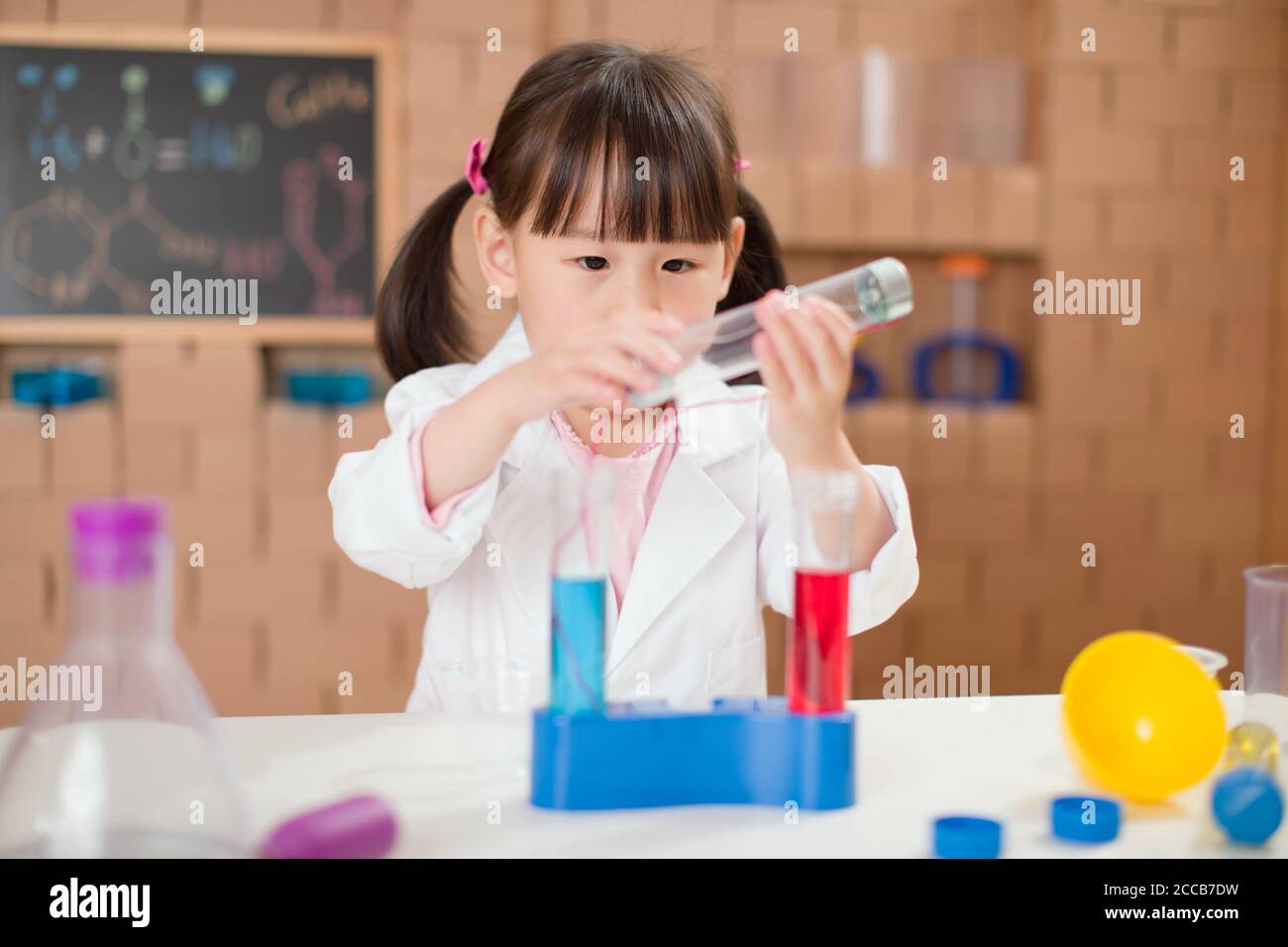 young girl play science experiments for homeschooling Stock Photo - Alamy