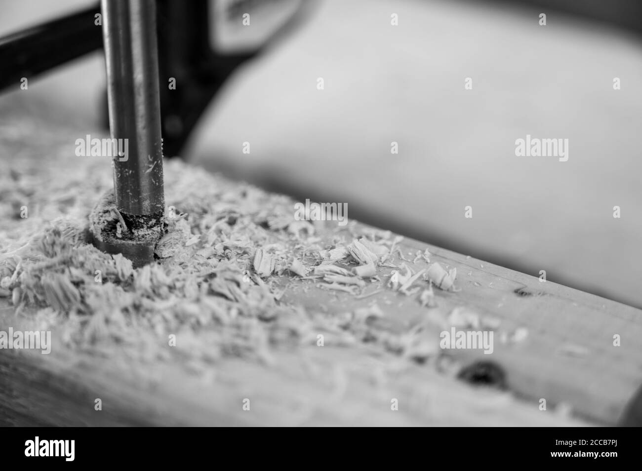 Drilling a hole into wooden board by using a power drill Stock Photo ...
