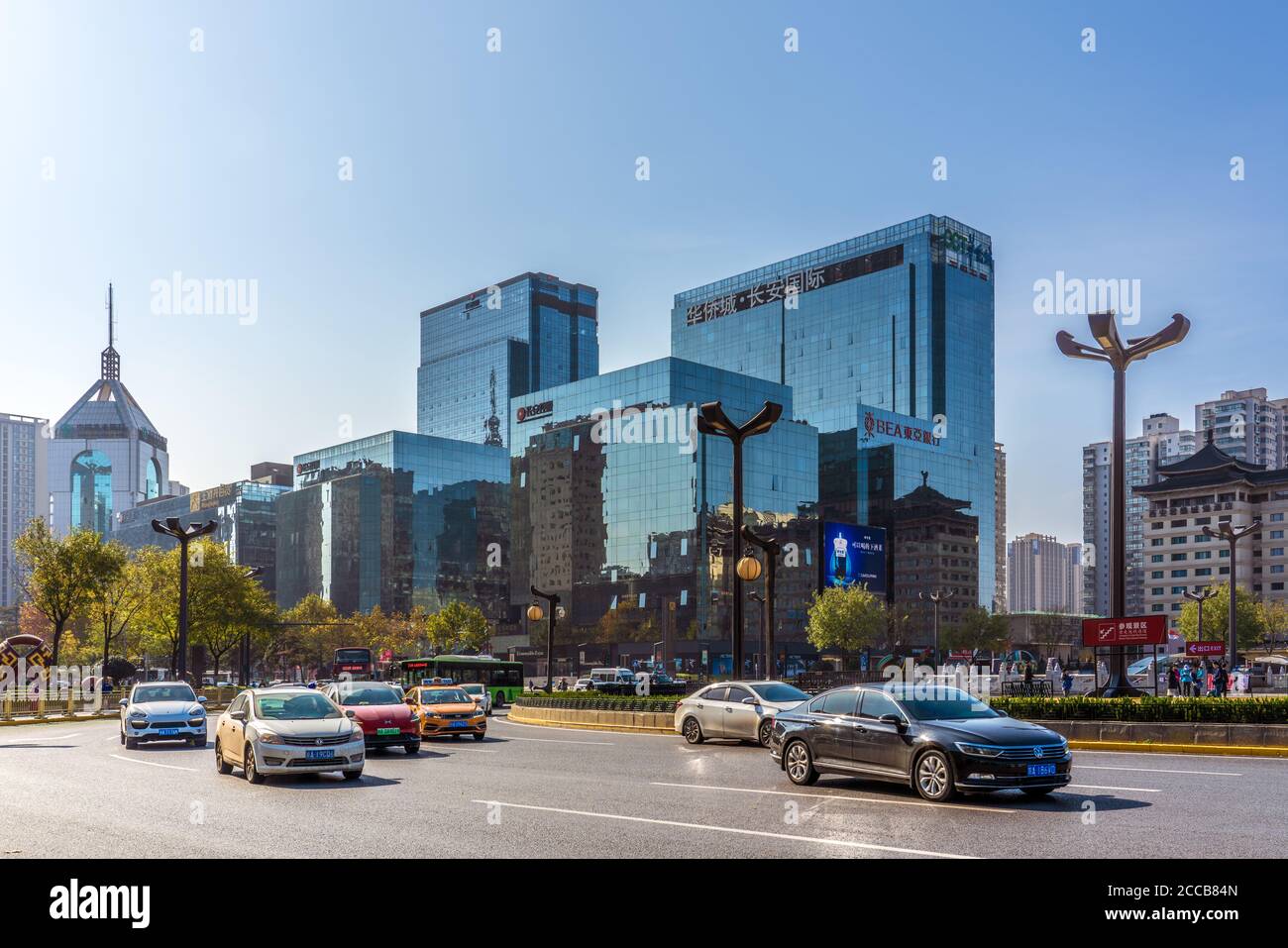 Cityscape of modern office buildings and shopping malls on a street ...