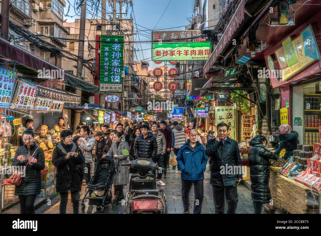 Crowded shopping street with tourists in the Muslim Quarter in Xian ...