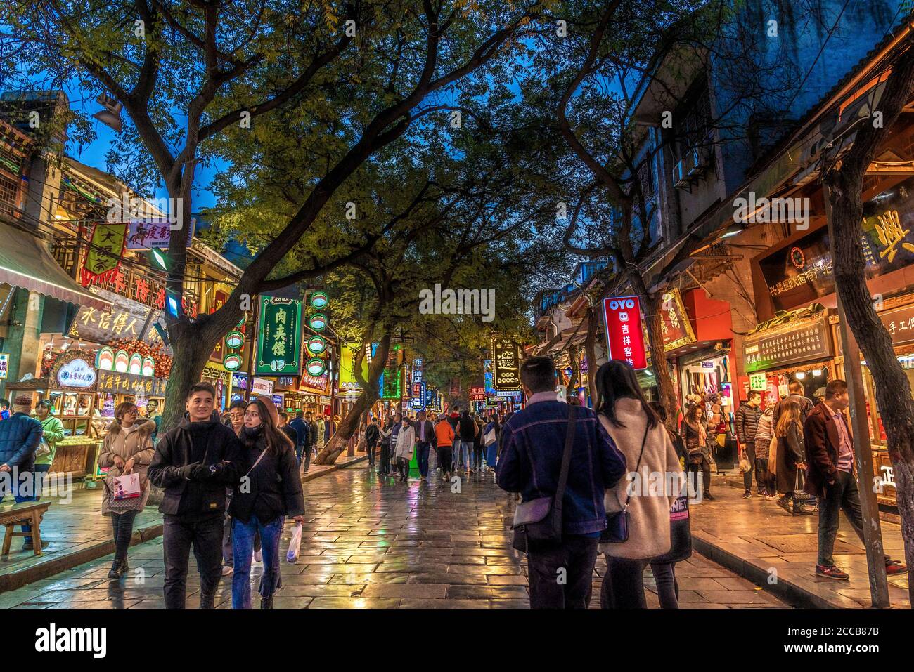 Night view of the Muslim Street, a famous shopping area in Xian, China ...