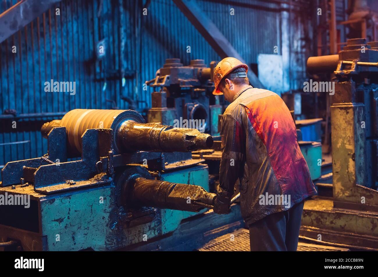 Heavy Industry Worker Working Hard on Machine. Rough Industrial ...