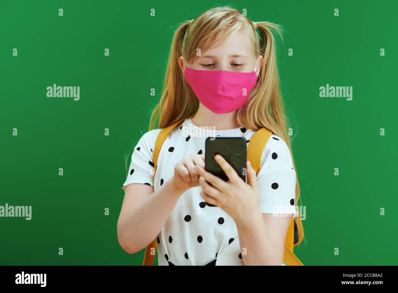 Life during coronavirus pandemic. modern child in white polka dot ...