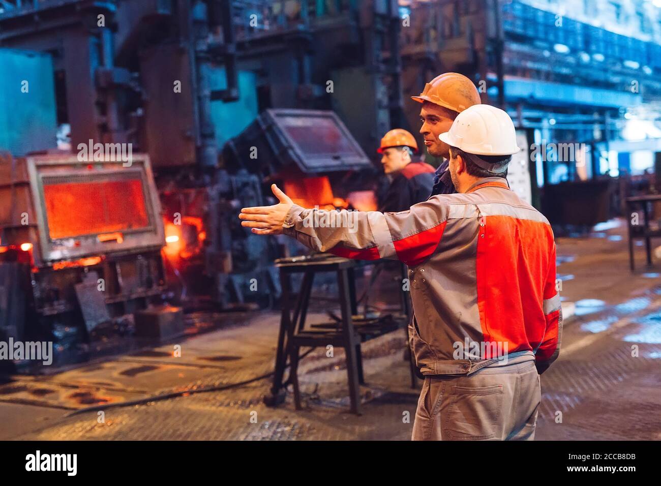 Workers in the steel mill. Industrial Environment Stock Photo - Alamy
