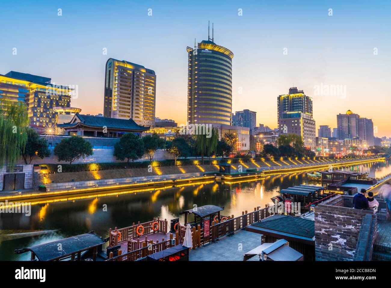 Evening view of downtown city buildings along the riverside outside the ...