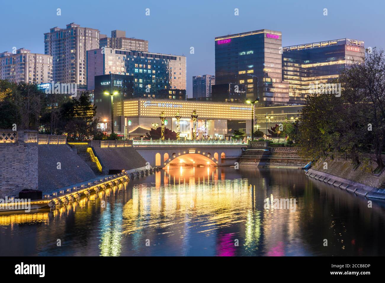 Night view of downtown city buildings along the riverside outside the ...