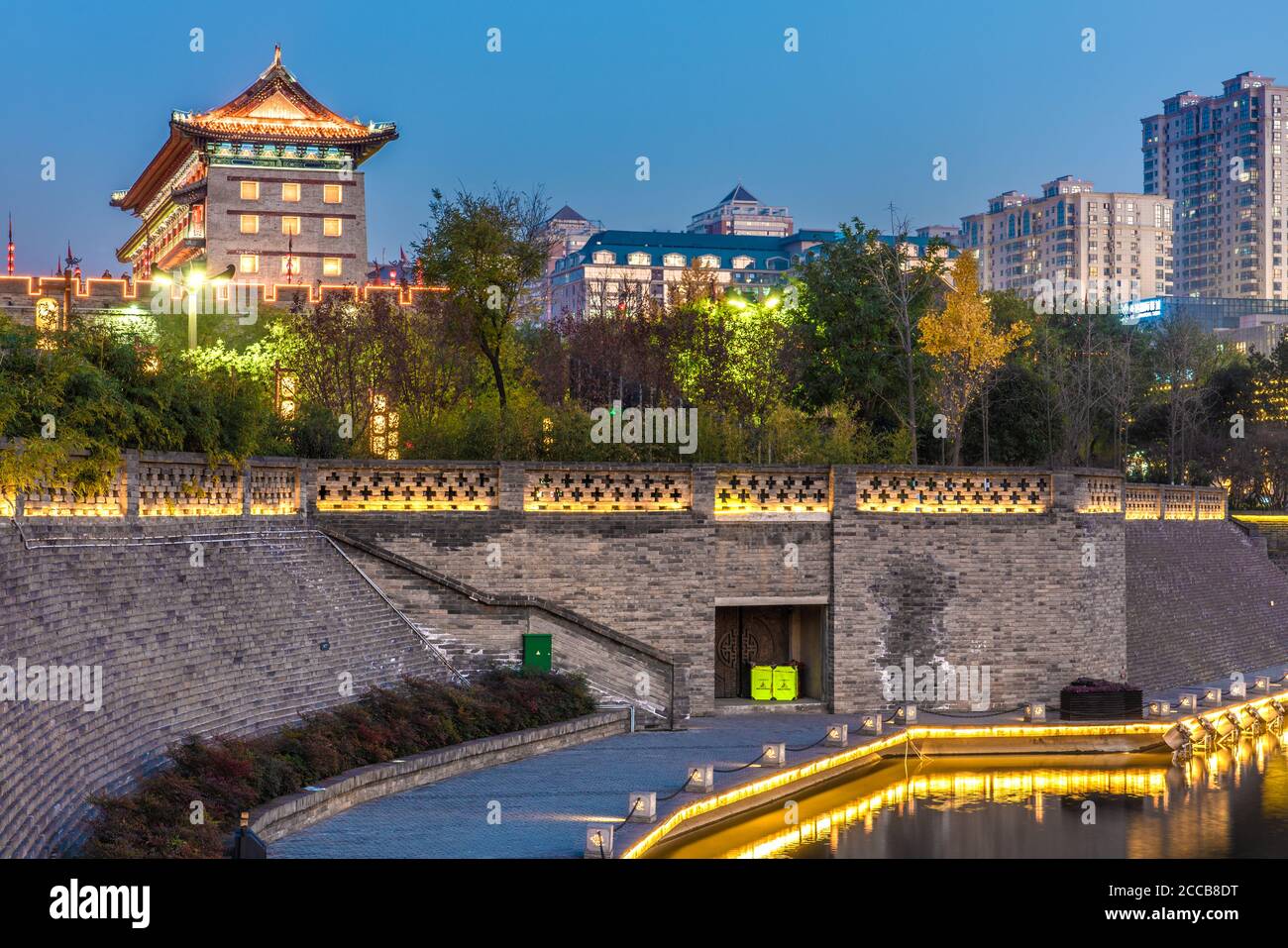 Night view of the Ancient City Wall riverside area and city buildings ...