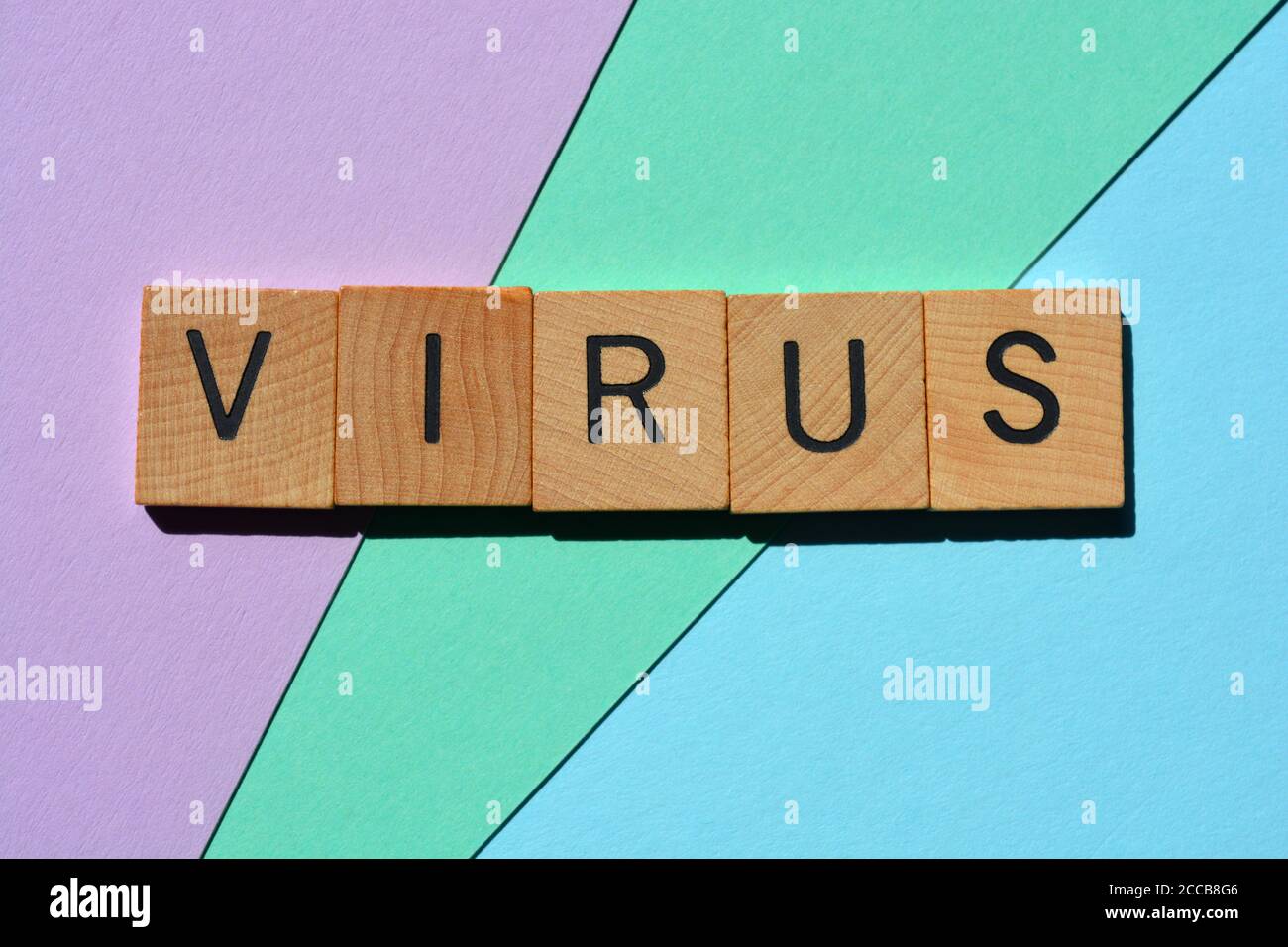 Virus, word in wooden alphabet letters isolated on colourful background ...
