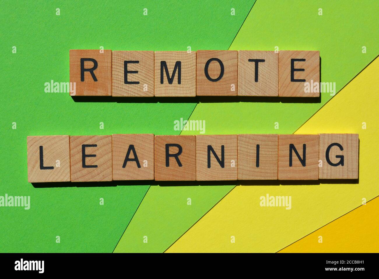 Remote Learning, words in wooden alphabet letters isolated on green ...