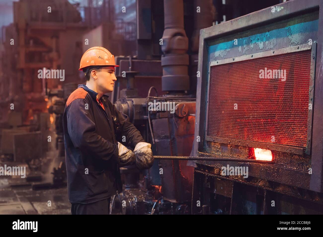 Workers in the steel mill. Industrial Environment Stock Photo - Alamy