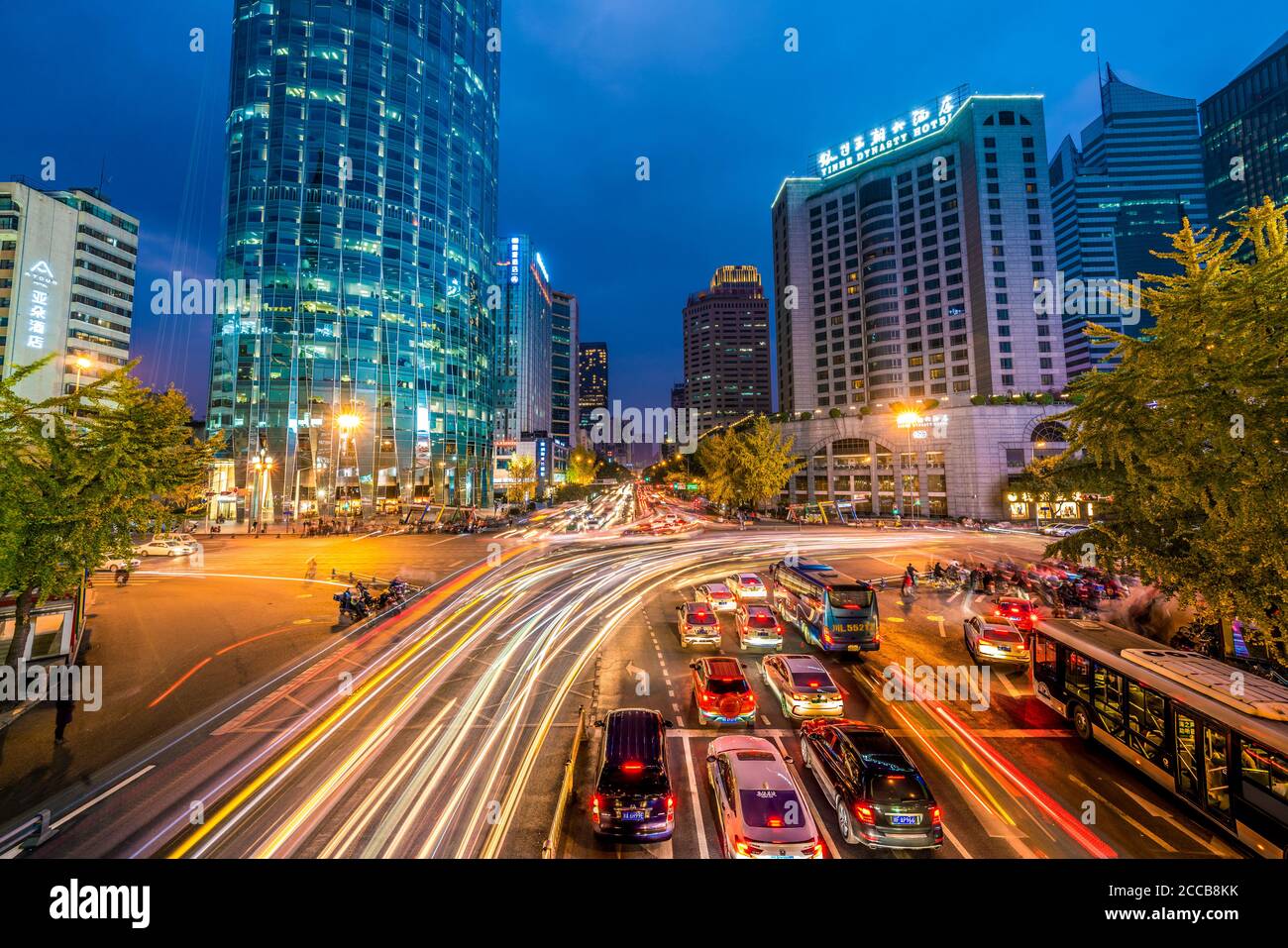 Night view of a city road with light trails in the downtown area of ...
