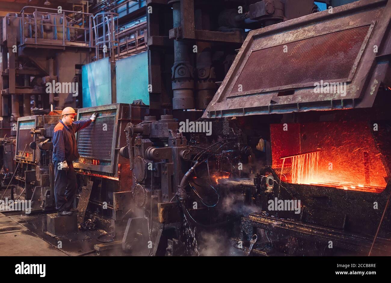 Workers in the steel mill. Industrial Environment Stock Photo - Alamy