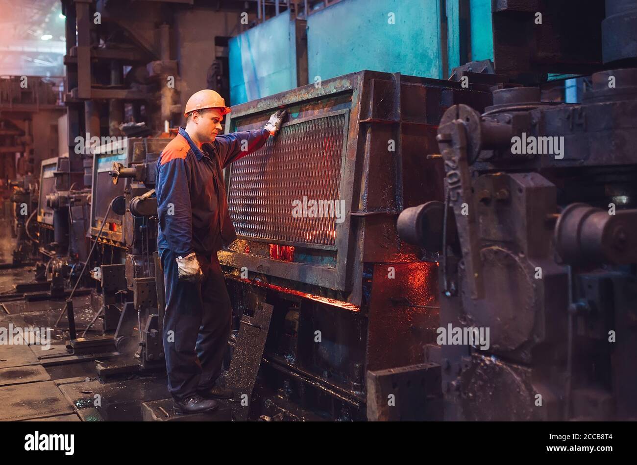 Workers in the steel mill. Industrial Environment Stock Photo - Alamy