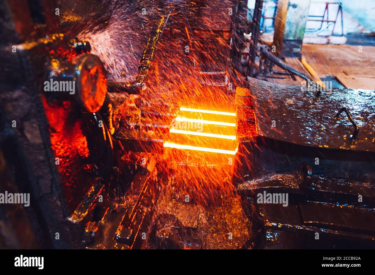 hot steel on conveyor in a steel mill Stock Photo - Alamy