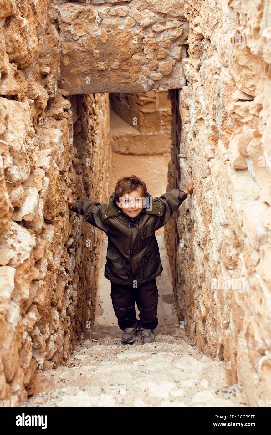 little cute real boy among ancient ruins, greek vacations Stock Photo ...