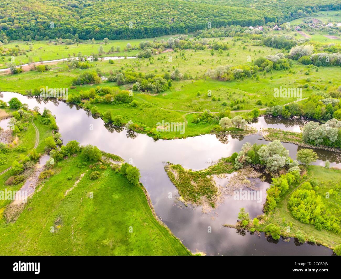 aerial drone landscape of river in green field, top view of beautiful ...