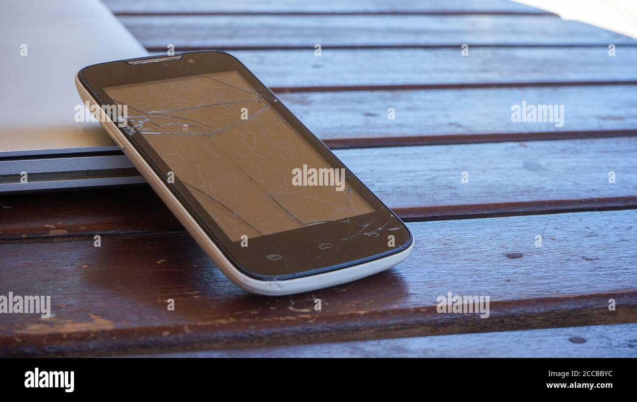 Close up the cell phone on the table Stock Photo - Alamy