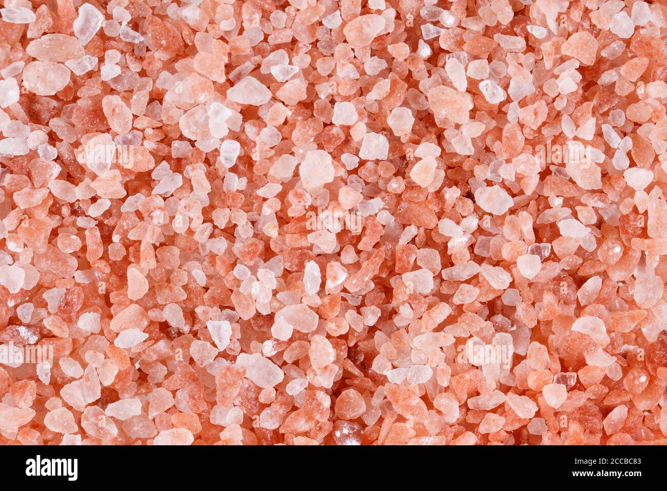 Pink himalayan salt isolated on white background Stock Photo - Alamy